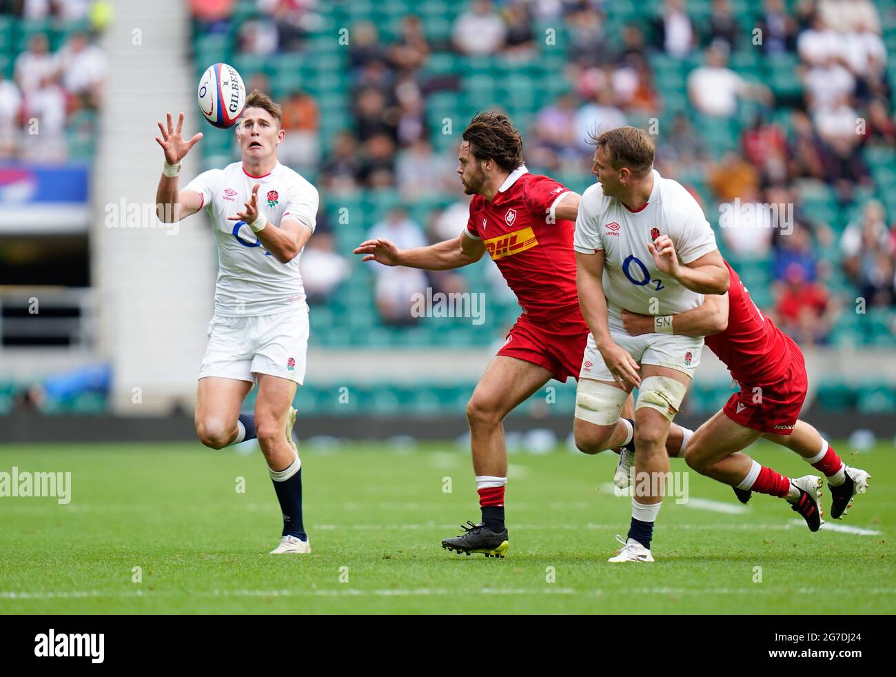 England No.8 Alex Dombrandt passes to fullback Freddie Steward during ...