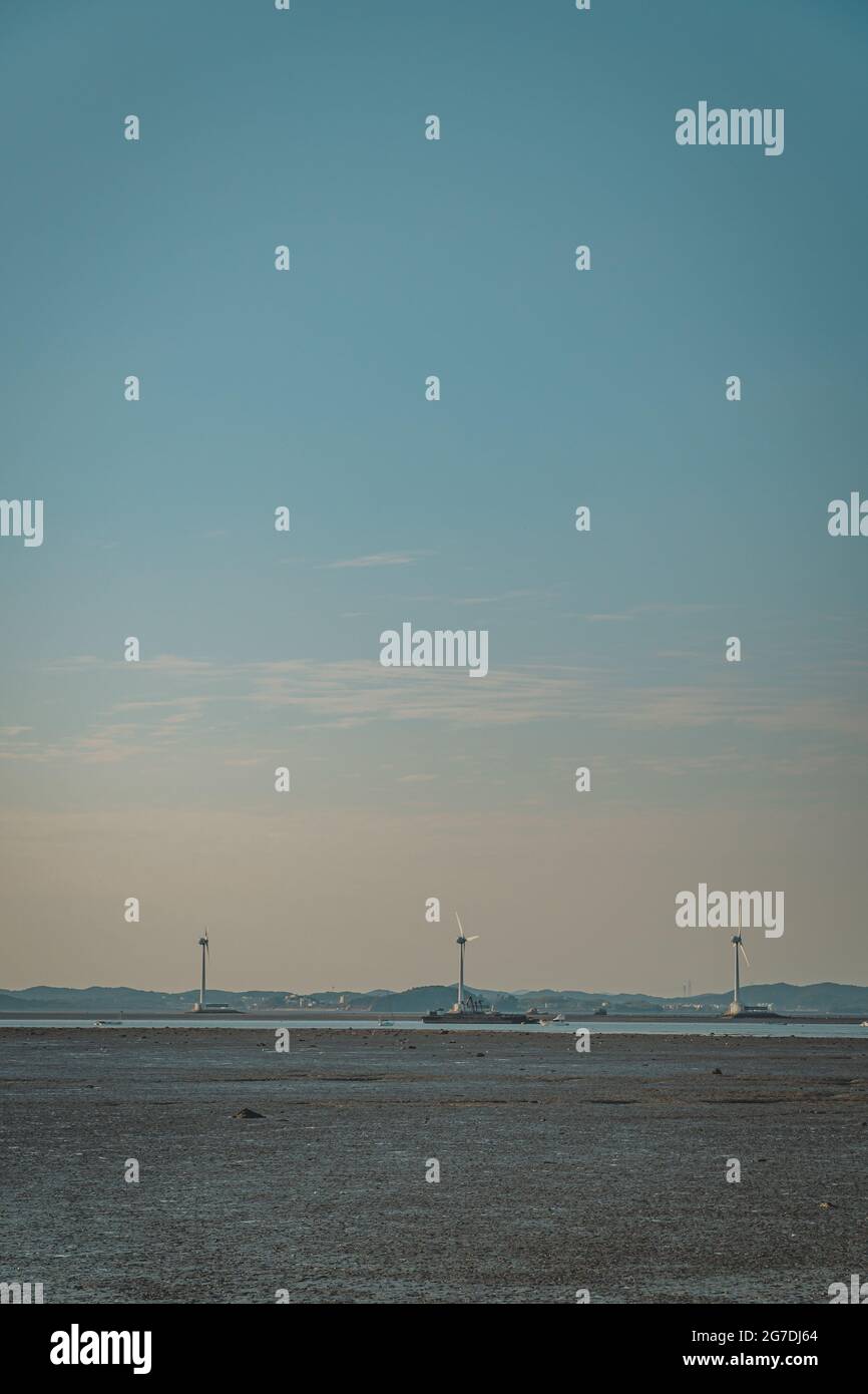 Row of wind turbines in a deserted area Stock Photo - Alamy