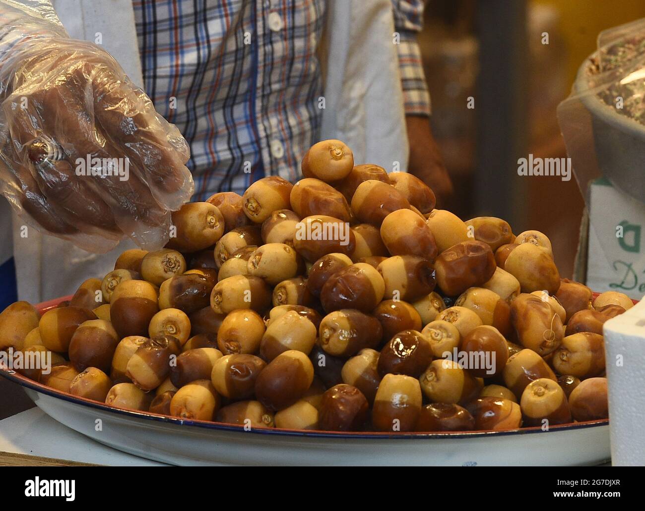 Kuwait City, Kuwait. 13th July, 2021. A vendor arranges dates inside ...