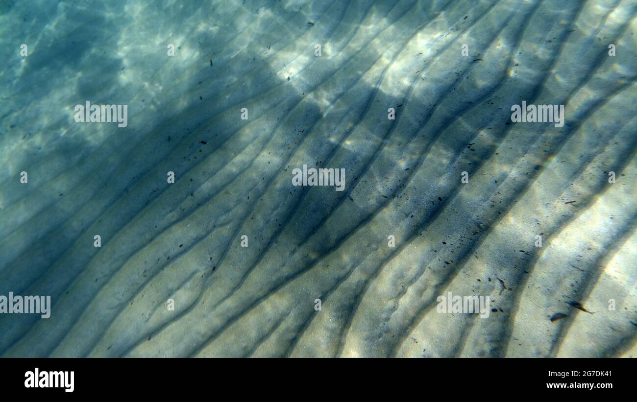sand bottom underwater while snorkeling in turquoise lagoon Stock Photo ...