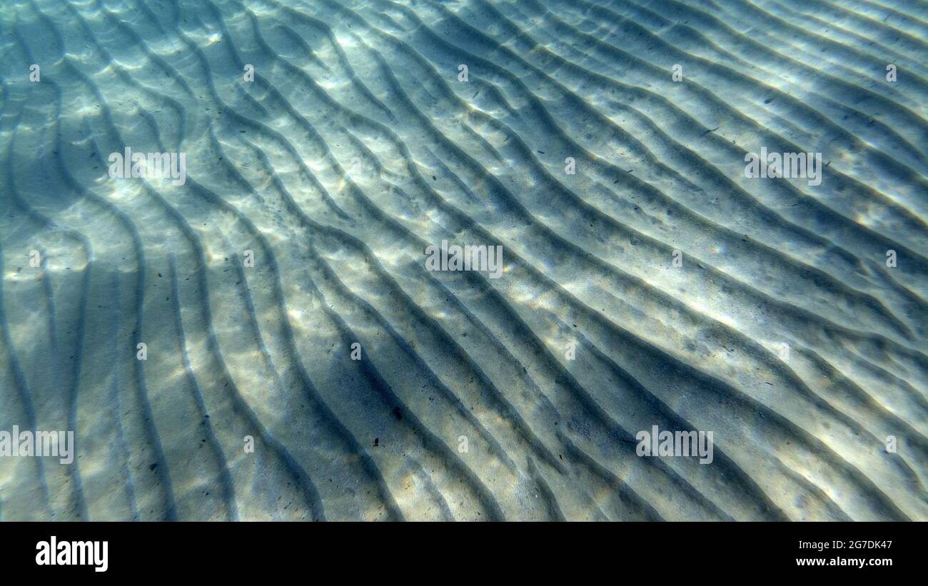 sand bottom underwater while snorkeling in turquoise lagoon Stock Photo ...