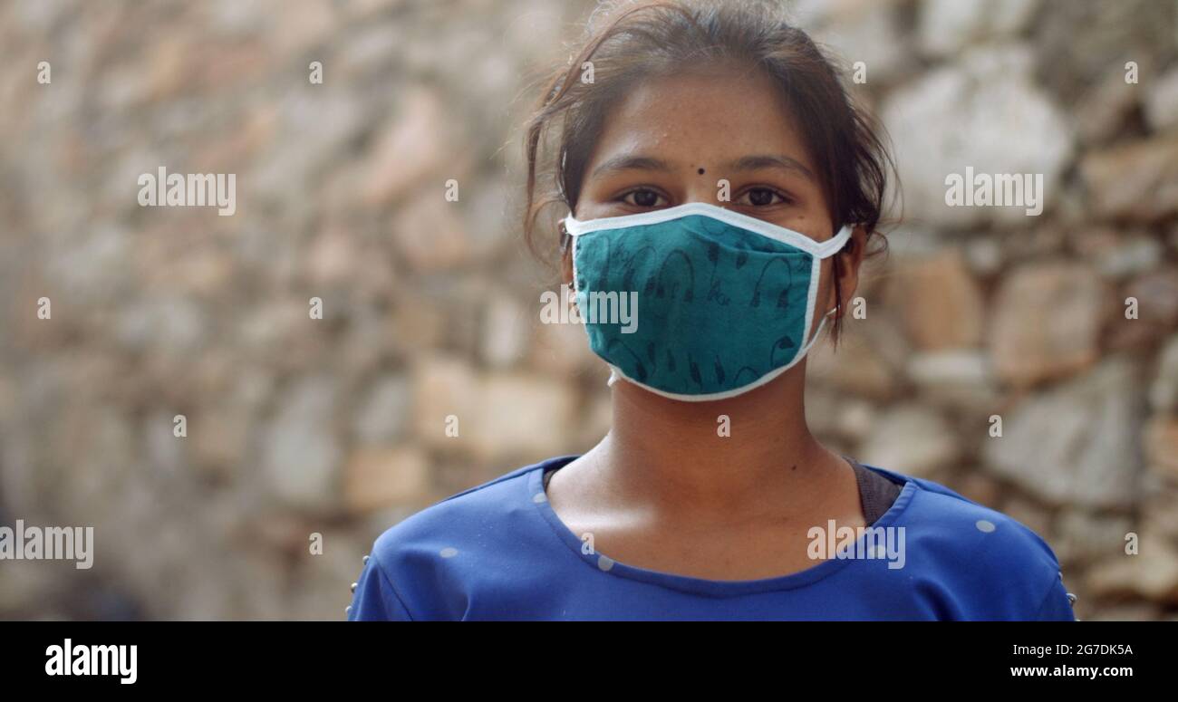 Closeup of a young female South Asian child with a traditional bindi ...
