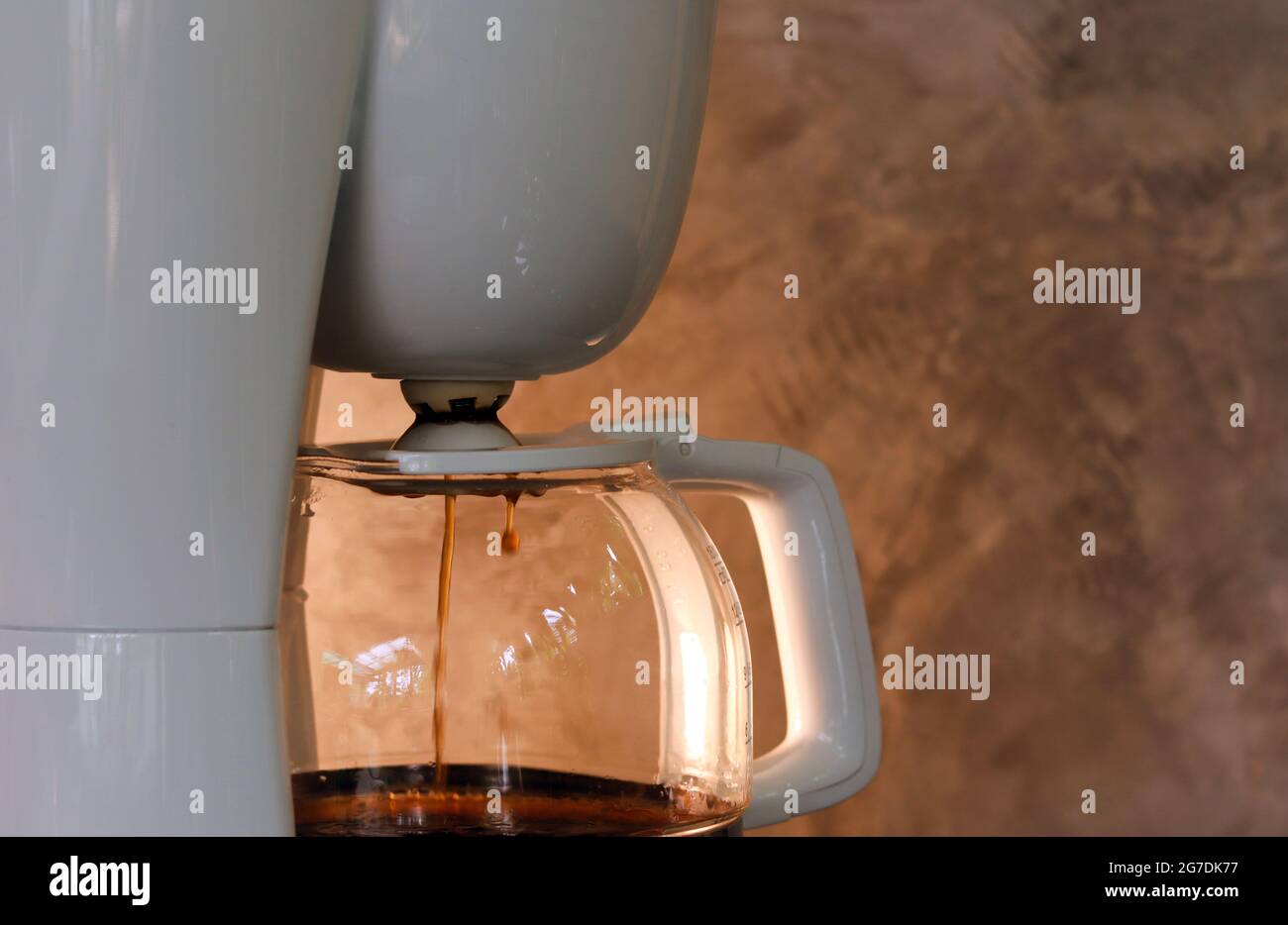 Coffee drip pot on process with coffee drip inside. Blurry gray ...