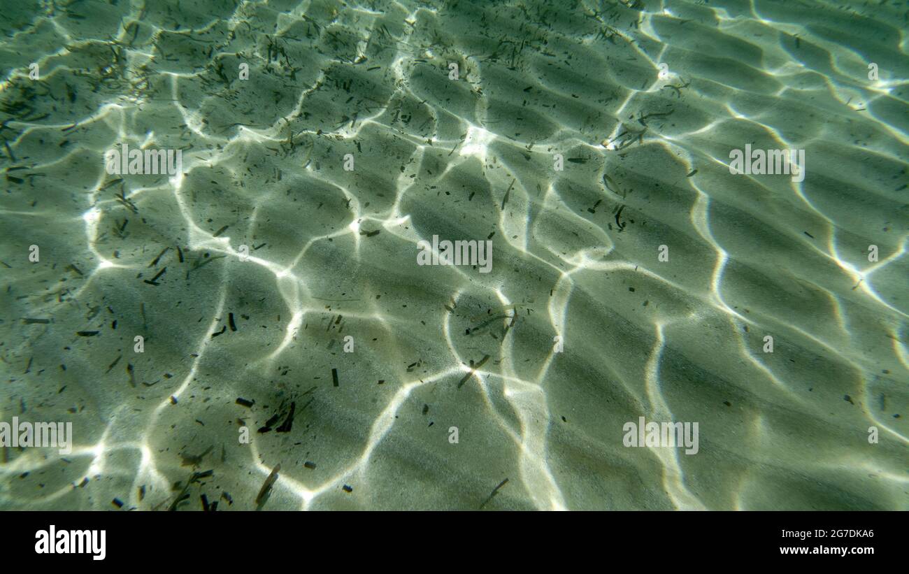 sand bottom underwater while snorkeling in turquoise lagoon Stock Photo ...