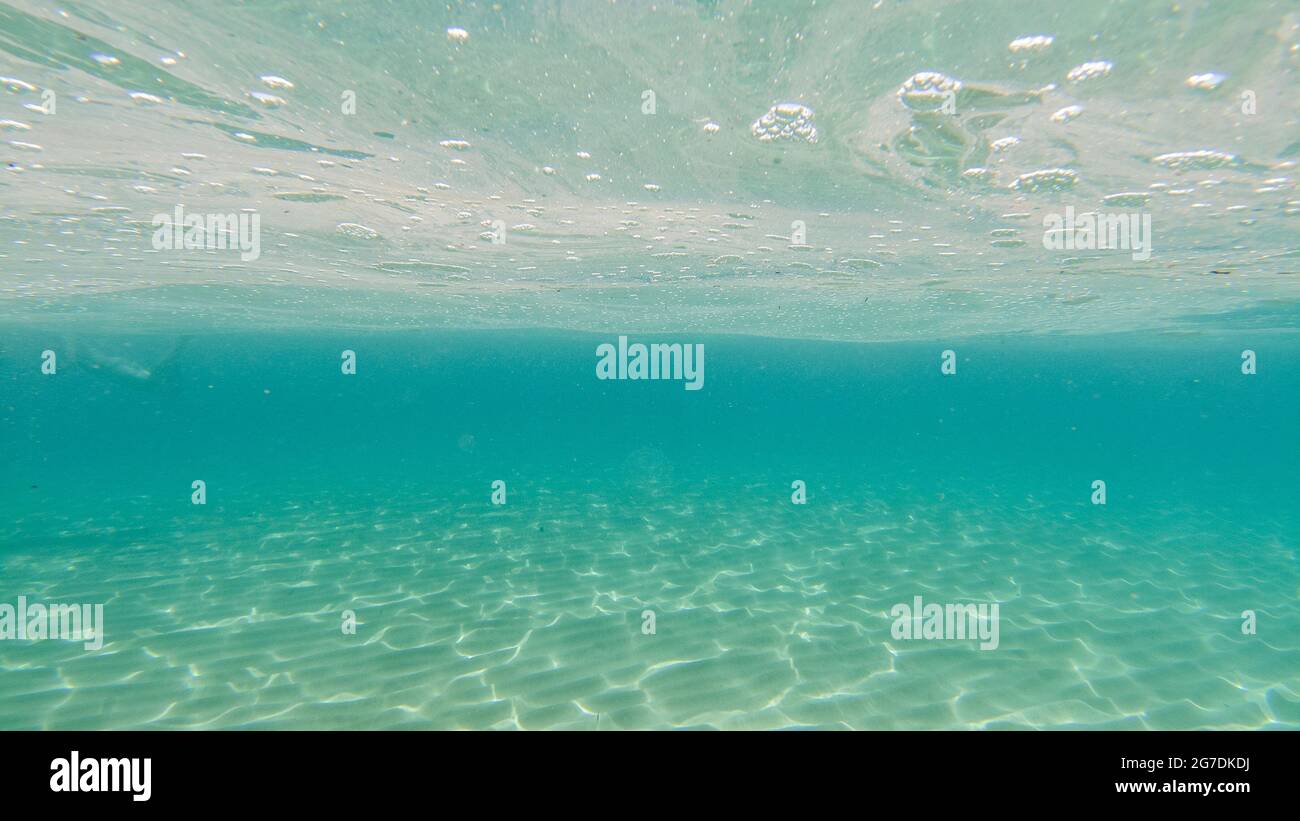 sand bottom underwater while snorkeling in turquoise lagoon Stock Photo ...