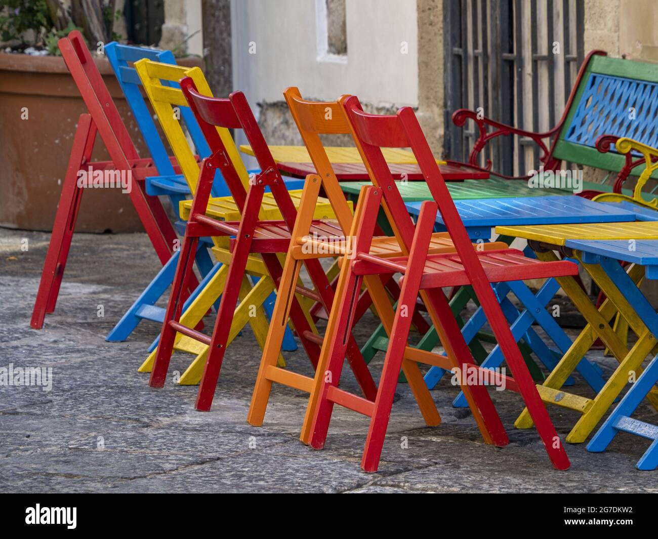 many colors wooden chairs and tables Stock Photo - Alamy