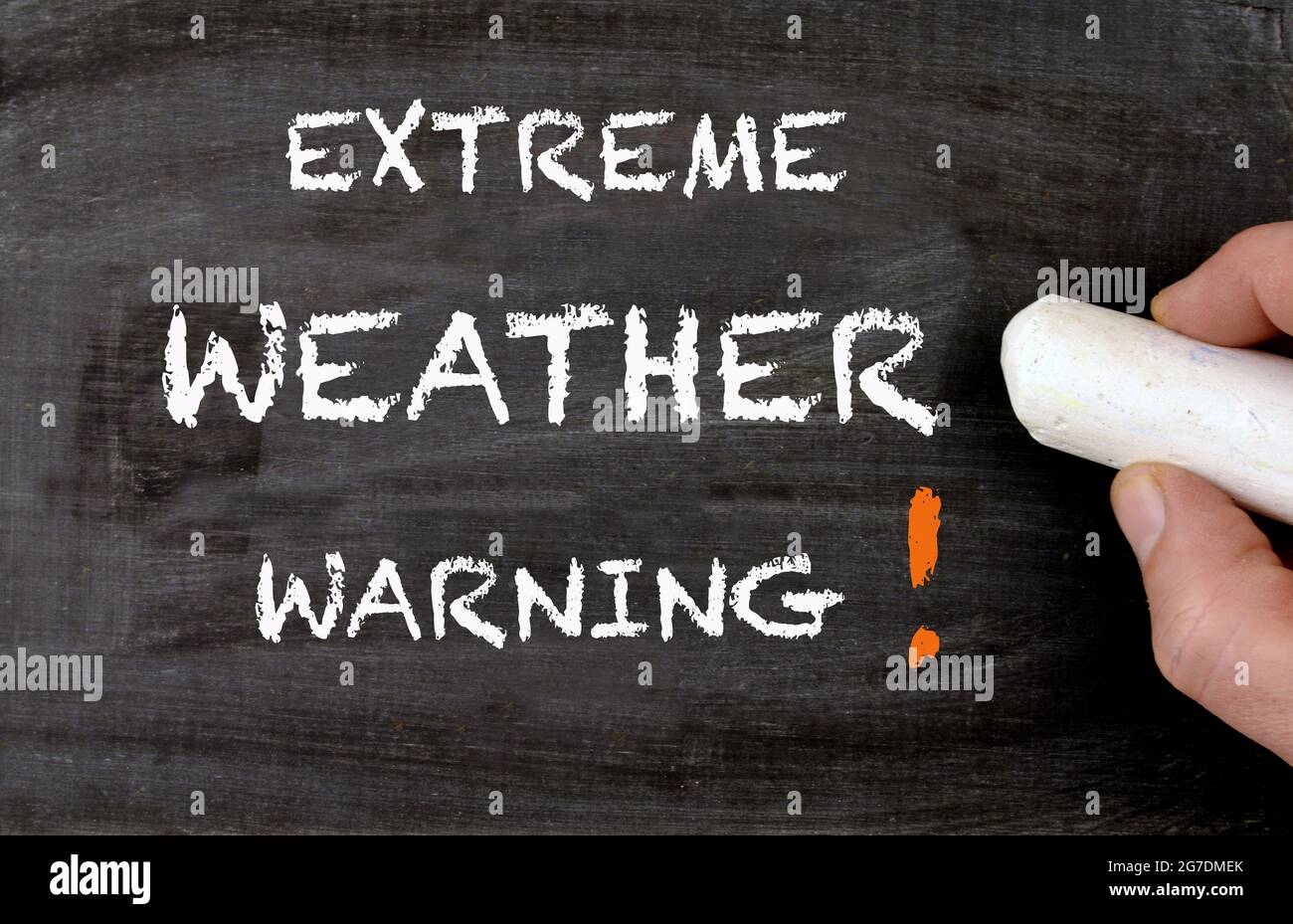 Extreme weather warning blackboard hand writing Stock Photo - Alamy