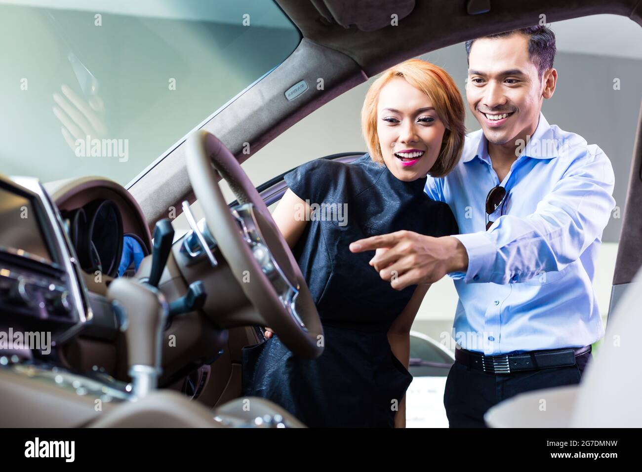 Asian couple choosing car hi-res stock photography and images - Alamy