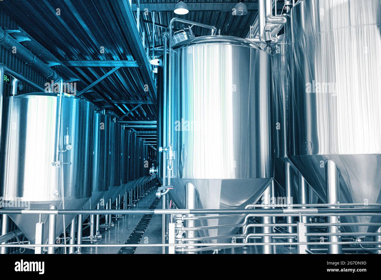 Private microbrewery. Modern beer plant with brewering kettles, tubes ...