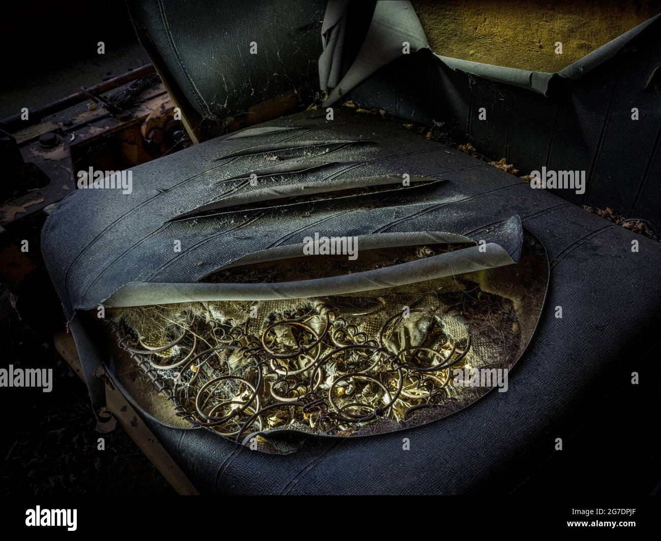 Torn and ripped seat cushion in abandoned bulldozer Stock Photo - Alamy