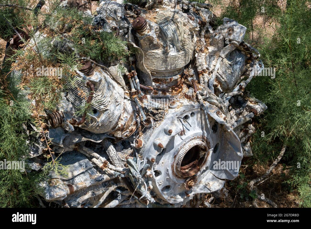 Old damaged and discarded aircraft radial engine in a bush near the ...