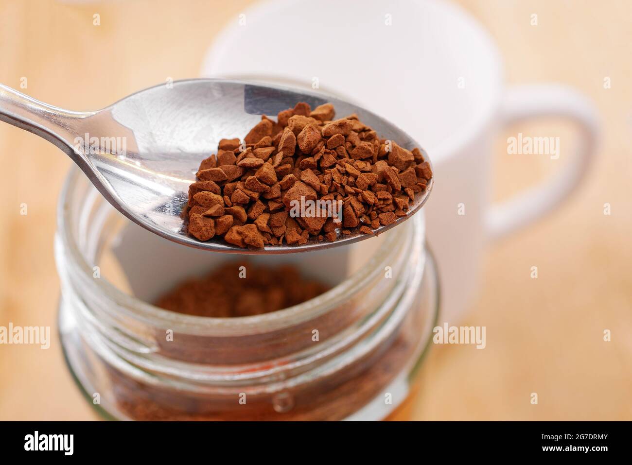 Closeup of spoon of instant coffee. Spoon of soluble coffee against the ...