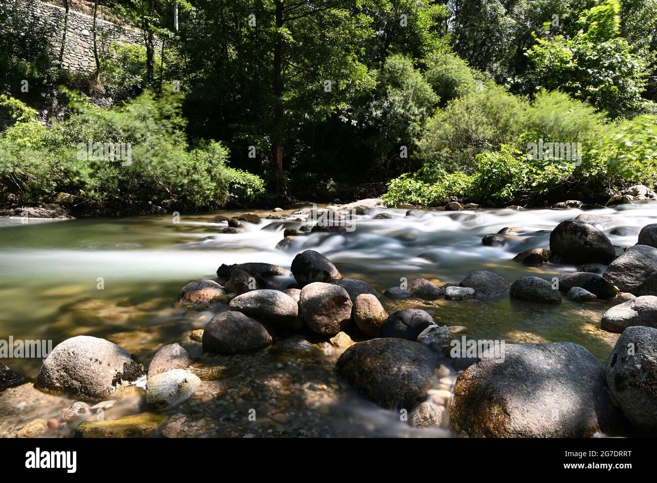 Nature Scene featuring beautiful river streaming through rocks Stock ...