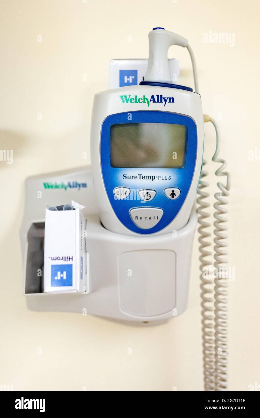 Close-up of Welch Allyn SureTemp clinical thermometer with probe and ...