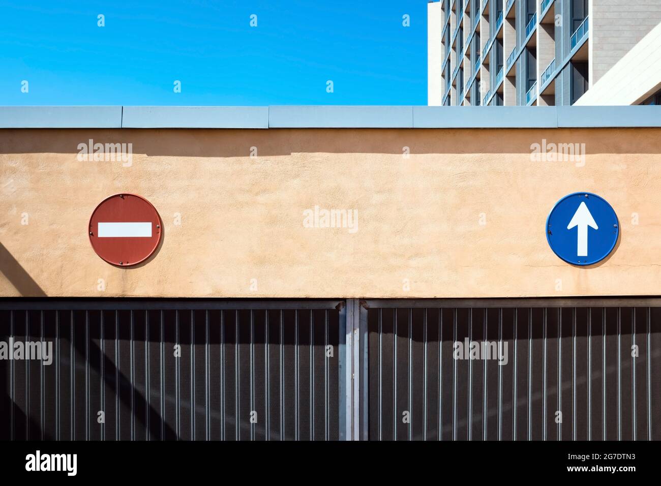 Direction and no-entry signs in a garage to guide traffic and indicate ...