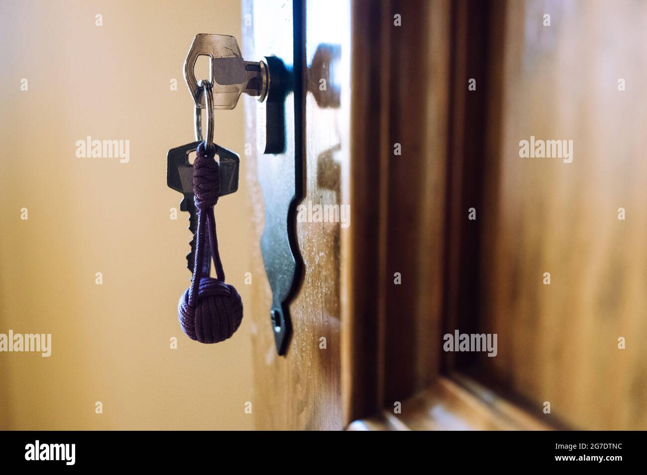 Door of a rural hotel room, with the key in the lock Stock Photo - Alamy