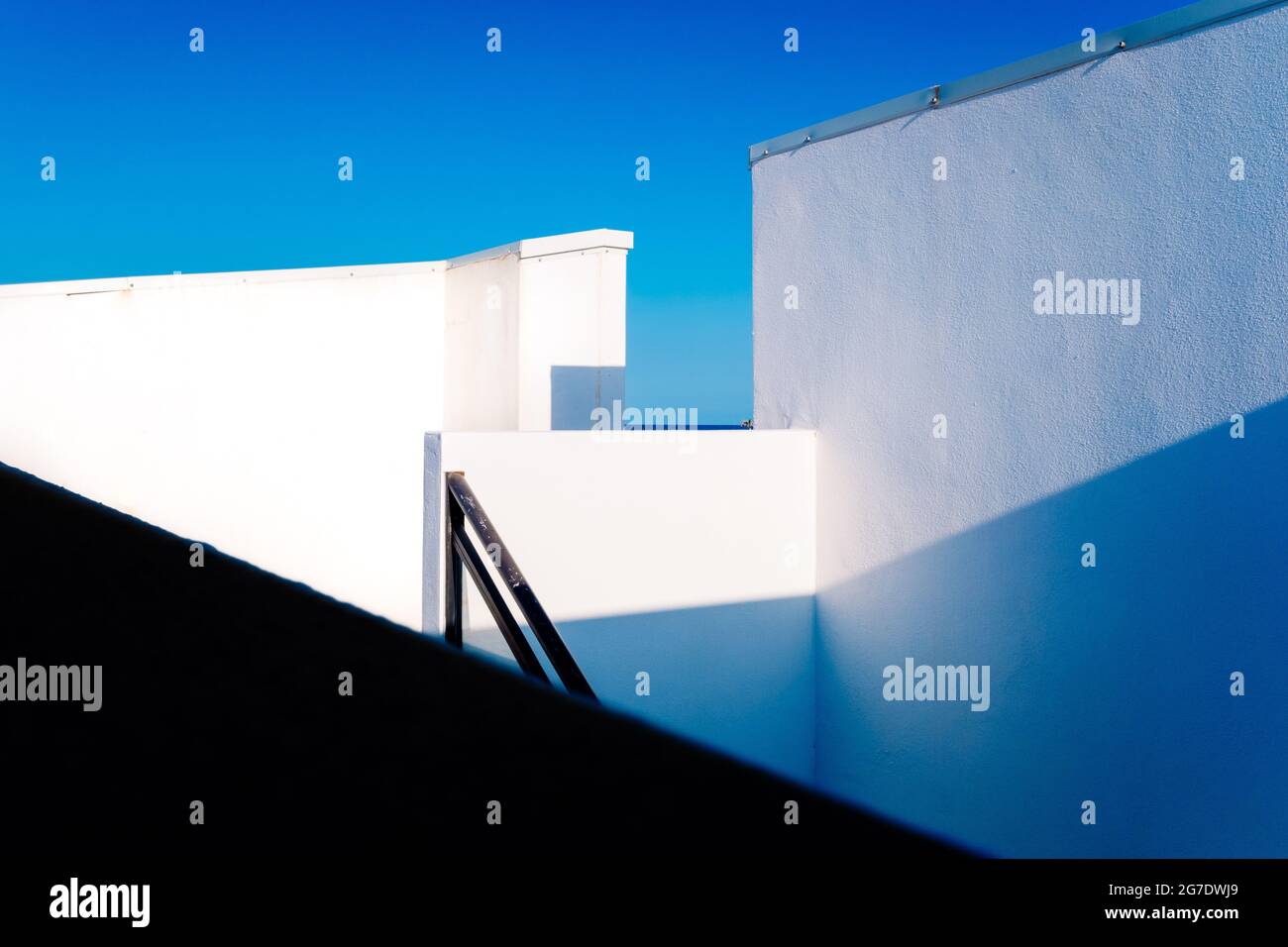 White walls geometric angled shapes of simple and clean design in sunny ...