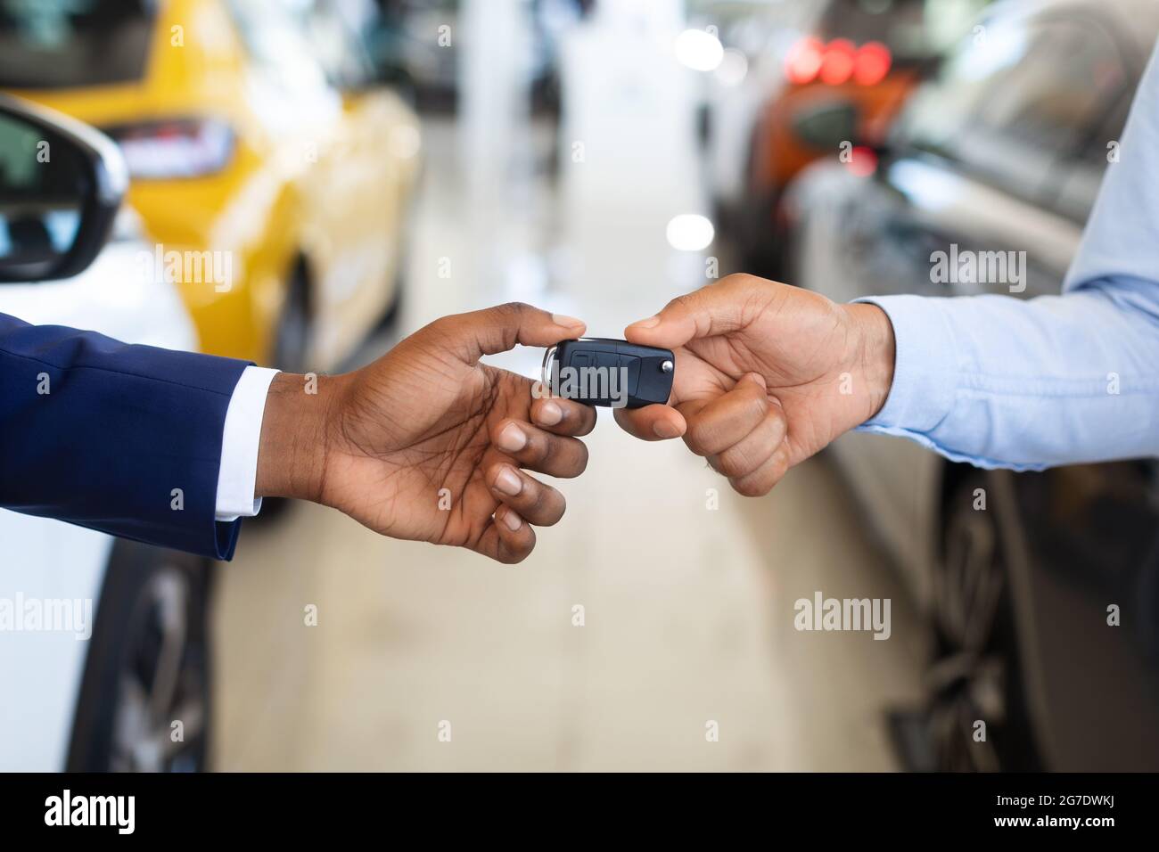 Black Male Customer Taking Car Keys From Seller In Dealership Center ...