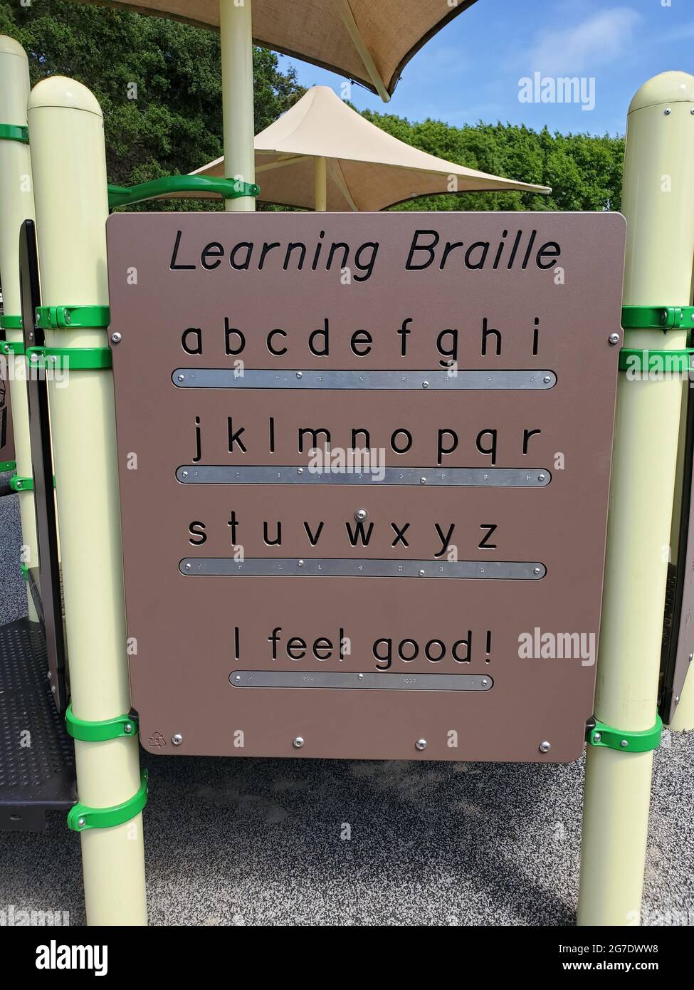 Playground with braille letters and sign reading Learning Braille in ...