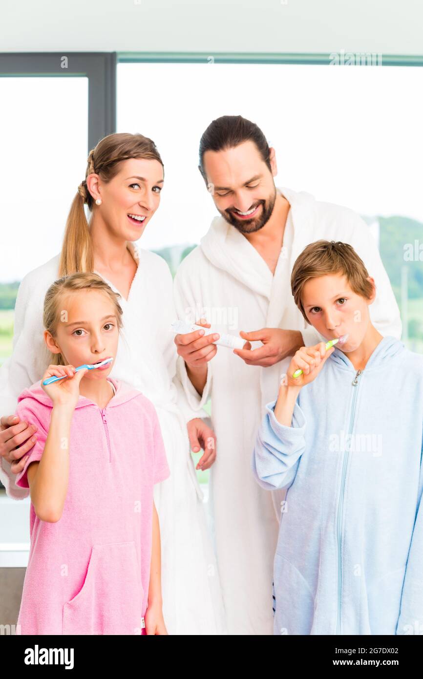 Boy and girl brushing teeth in bathroom hi-res stock photography and ...