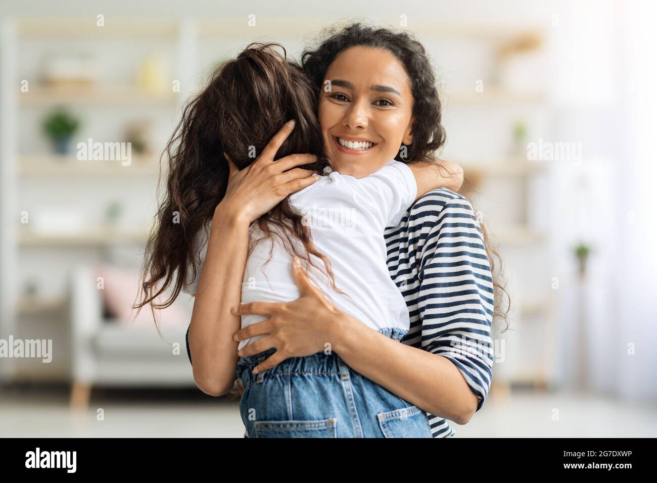 Loving middle-eastern mother hugging her little daughter Stock Photo - Alamy