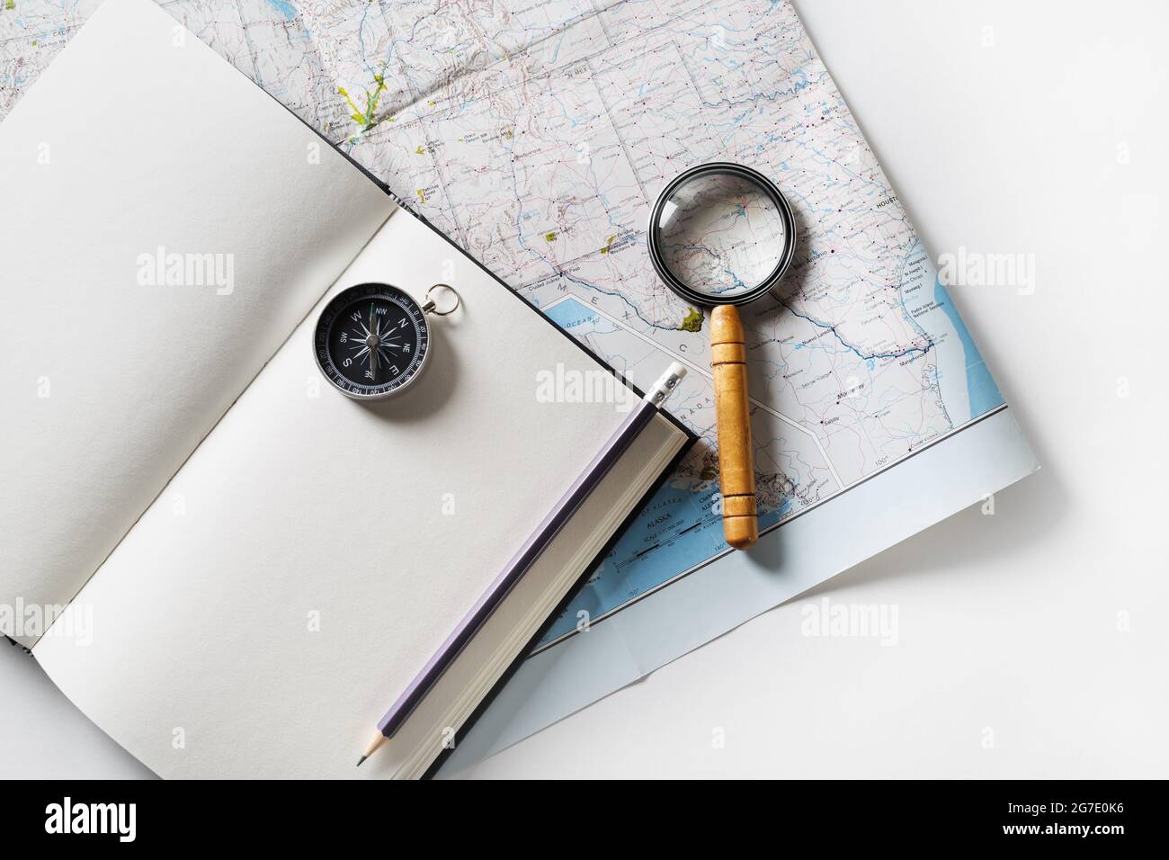 Travel plan background. Ready for the trip. Map, blank book, magnifier ...