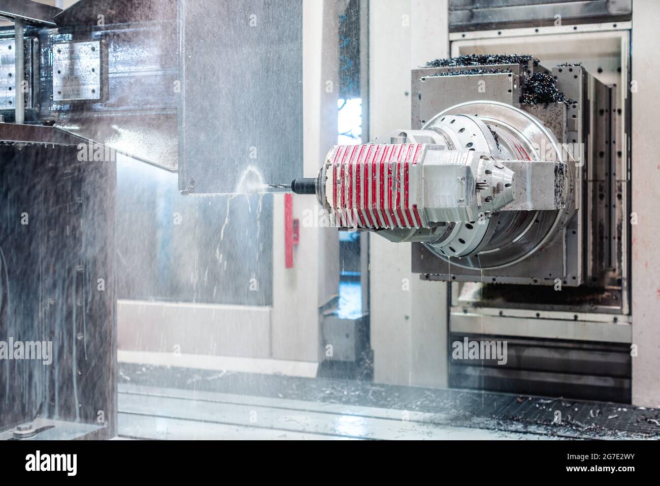 Industrial milling machine robot working on workpiece Stock Photo - Alamy