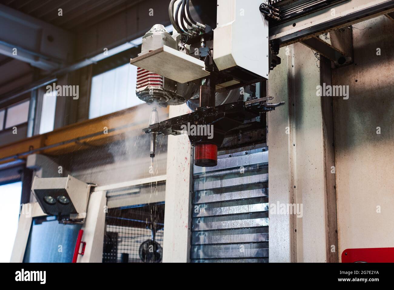 Industrial milling machine robot working on workpiece Stock Photo - Alamy