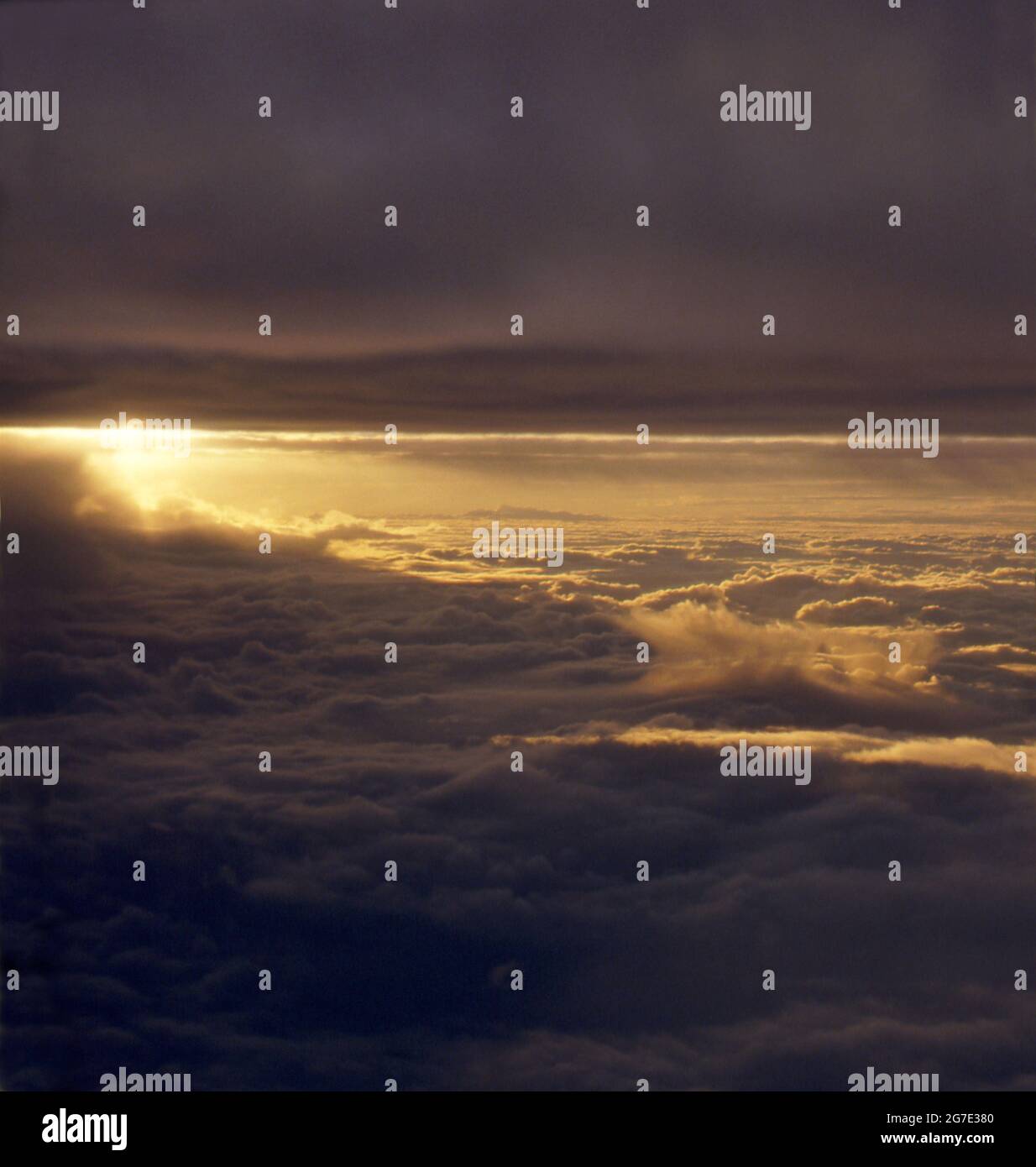 Descending through rainstorm with sunset visible between 2 layers of ...
