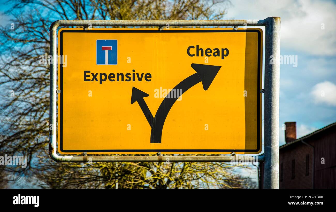Street Sign the Direction Way to Cheap versus Expensive Stock Photo - Alamy