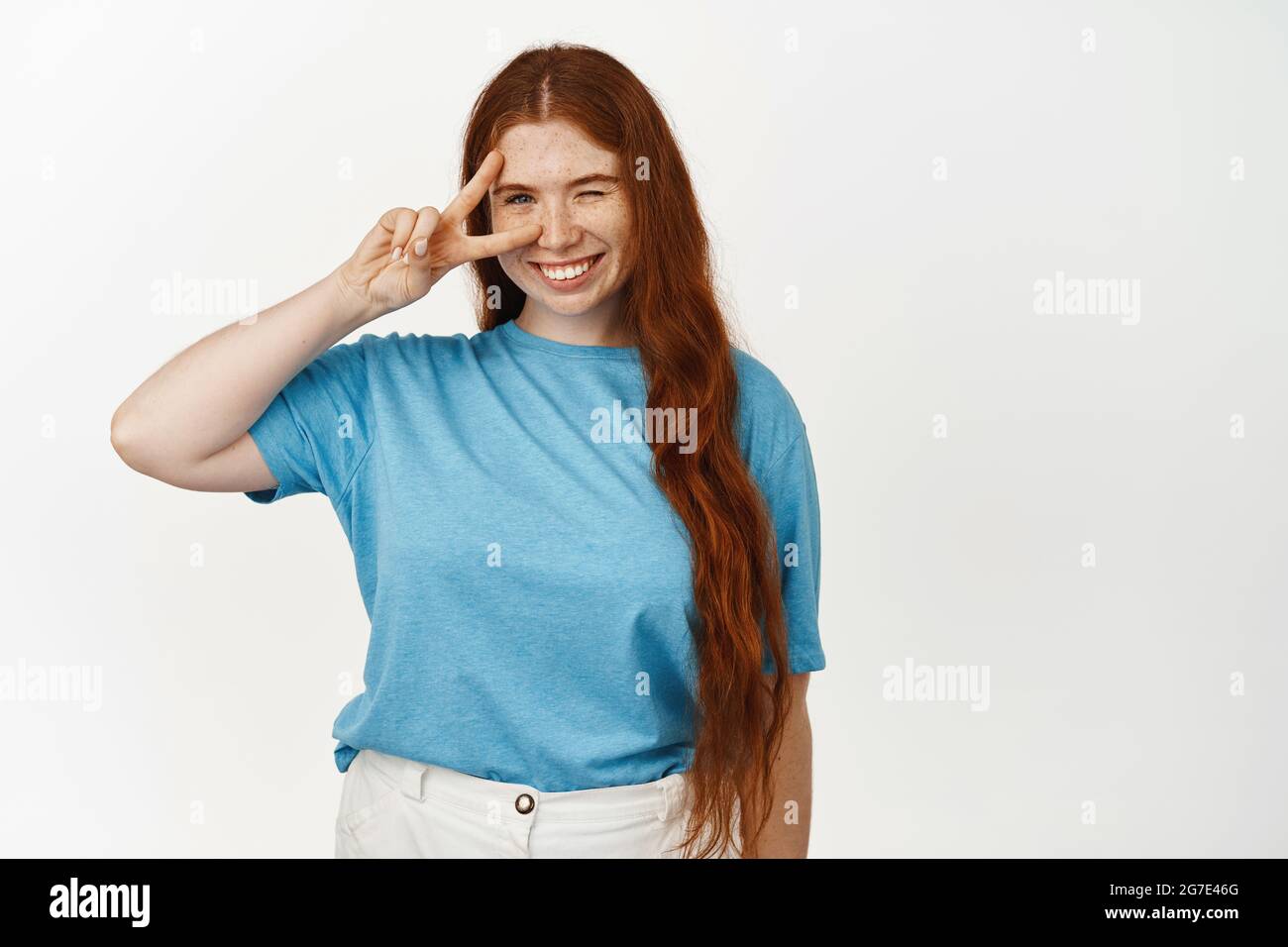 Positive ginger girl with long natural hair and freckles, white smile ...