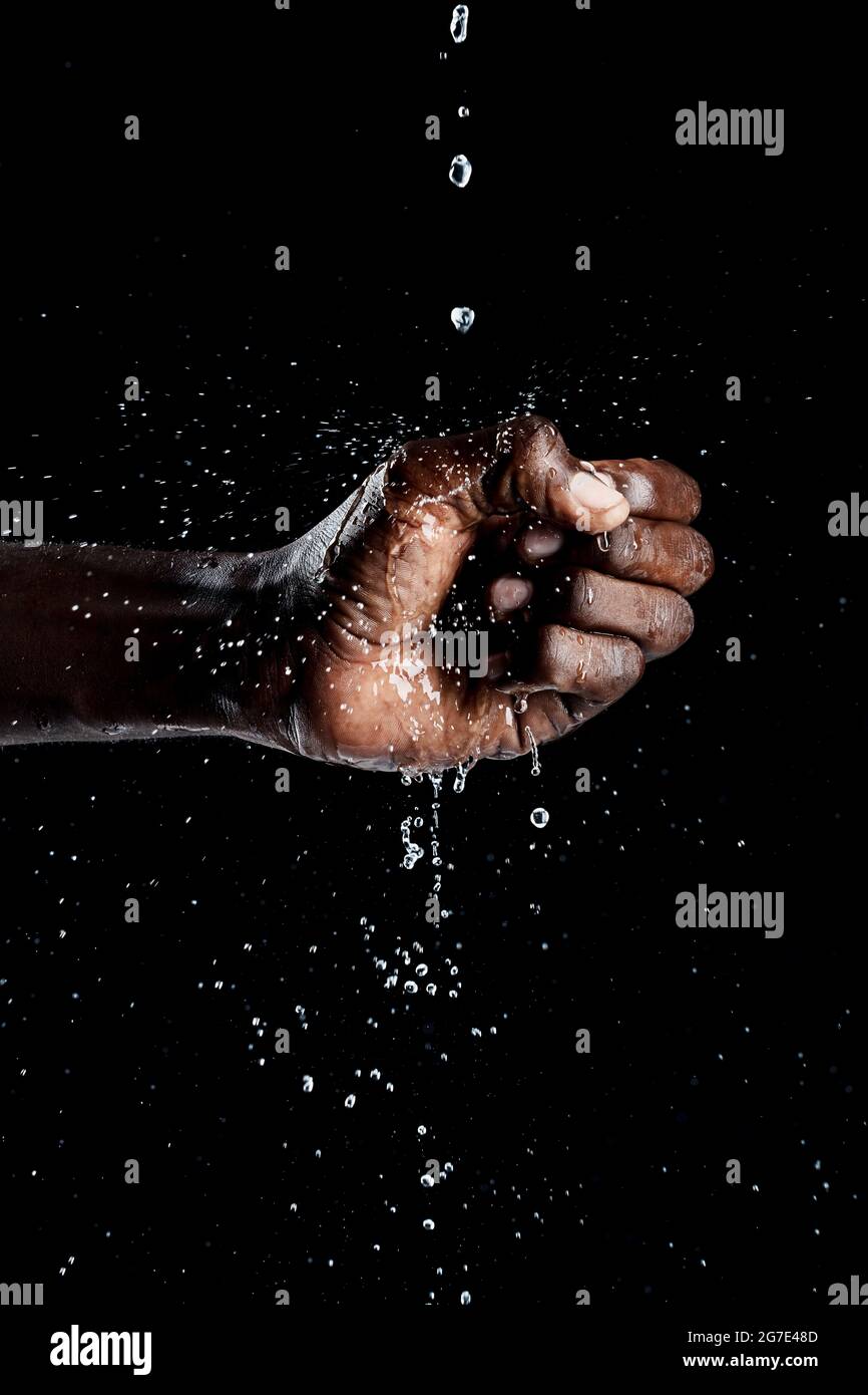 Hand punch through water hi-res stock photography and images - Alamy