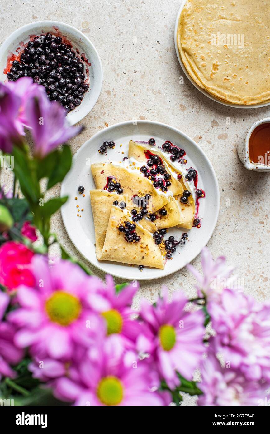 Wild Blueberry Crepes with purple flowers Stock Photo - Alamy