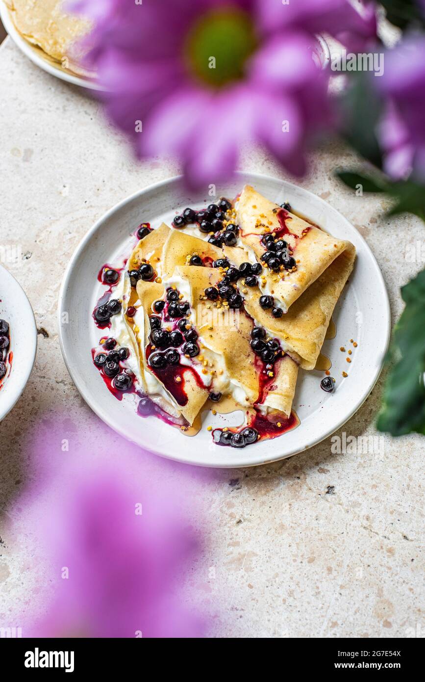 Wild Blueberry Crepes with purple flowers Stock Photo - Alamy