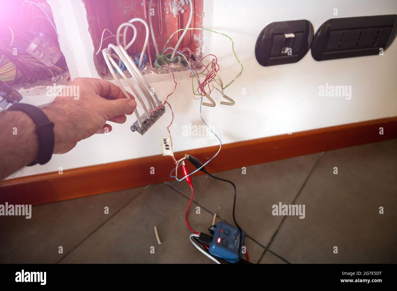 A telephone junction box has been opened: a line test tool has been ...