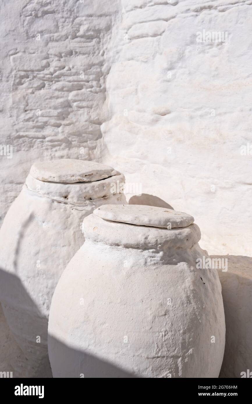 Ceramic Pots, Greek pithari covered with stone painted white outdoors ...