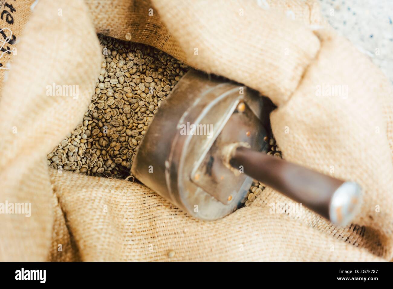 Bag of raw coffee beans ready to be roasted Stock Photo - Alamy