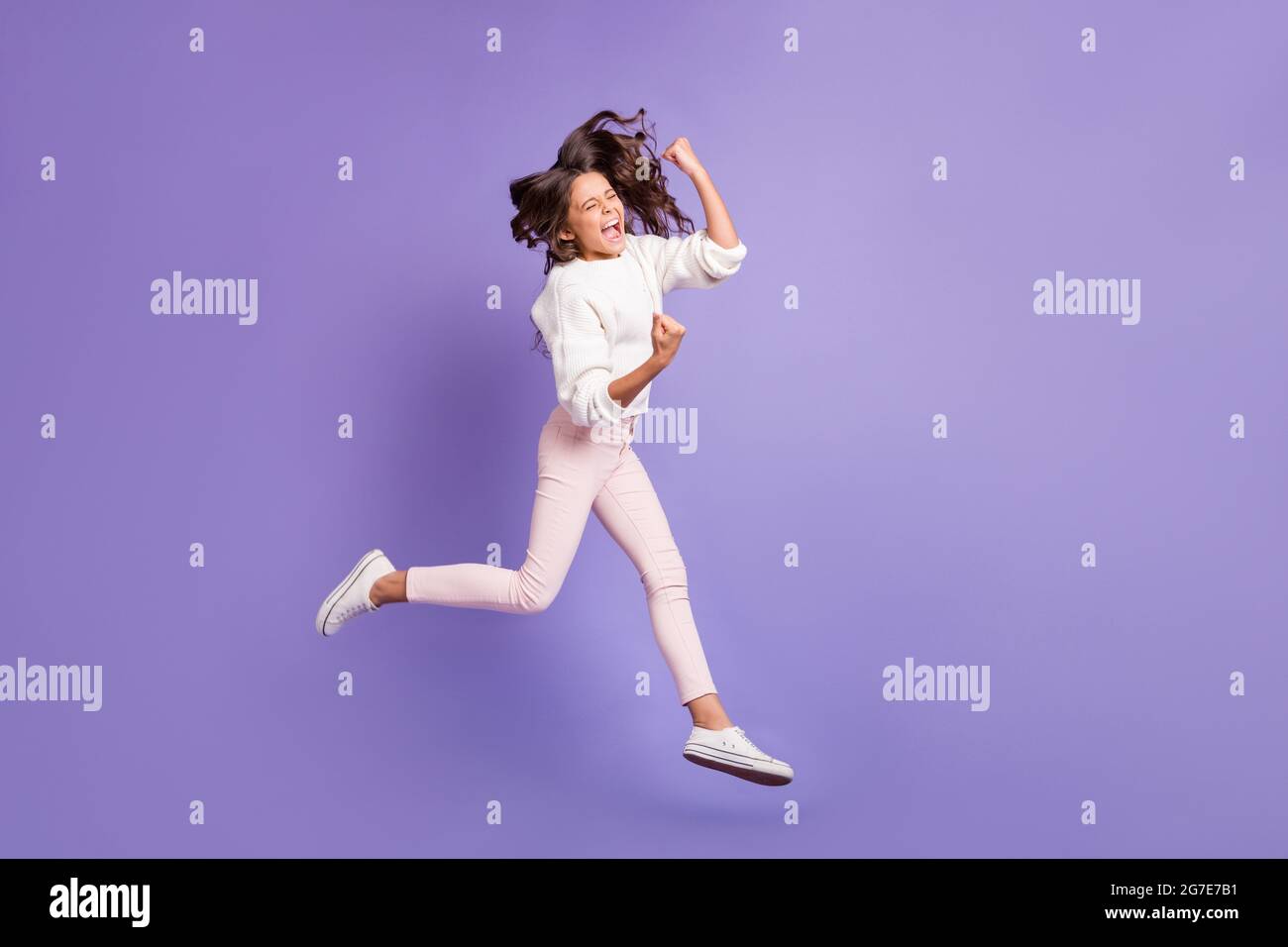 Full body photo of young girl happy rejoice jump run fists hands scream ...