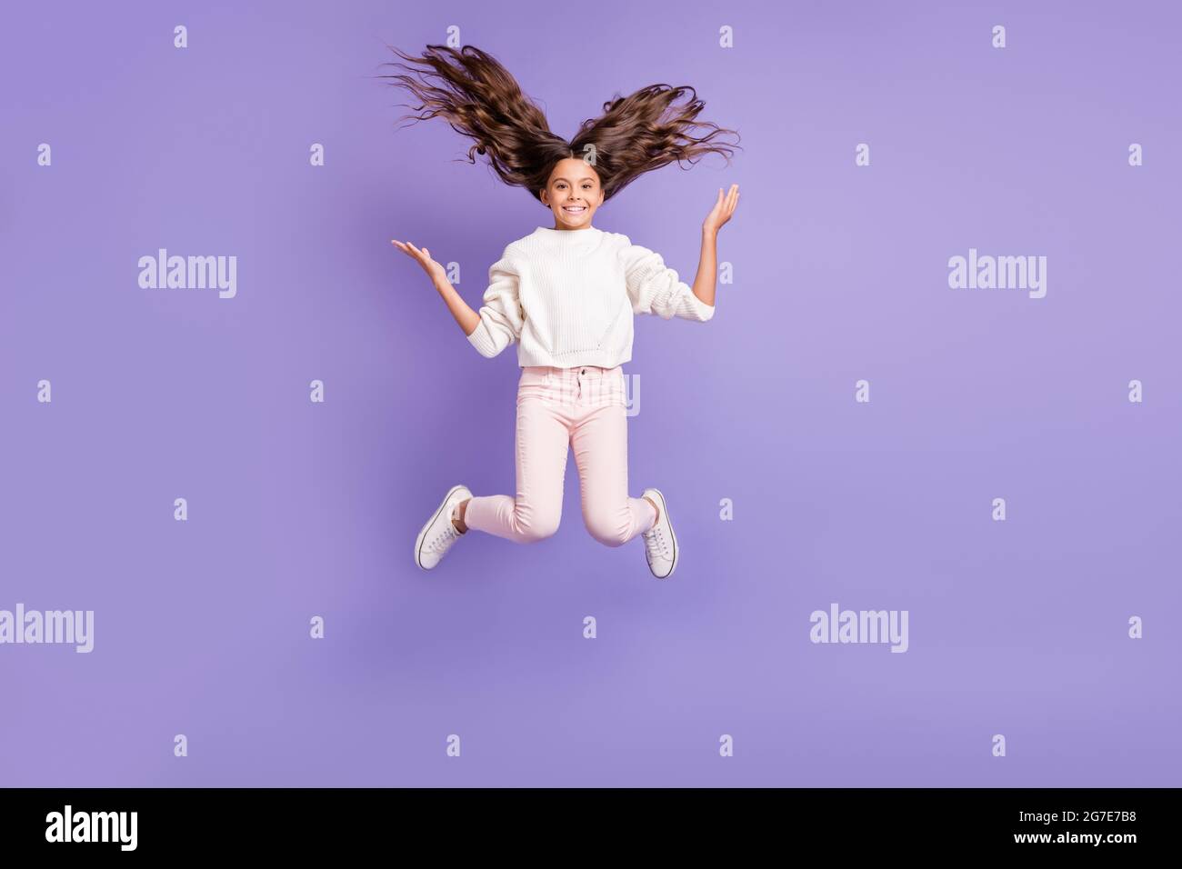 Full length photo of young schoolgirl happy positive smile jump have ...