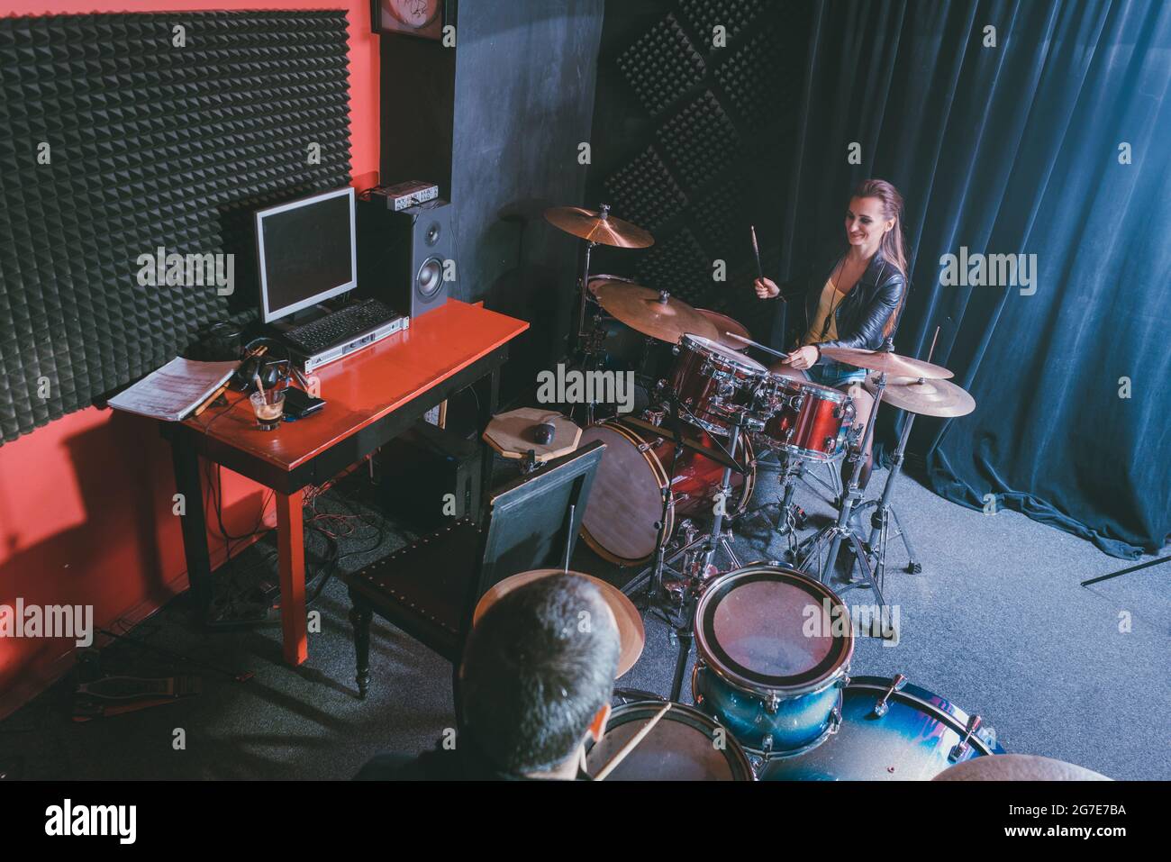 Woman receiving drum lessons from her music teacher in school Stock ...