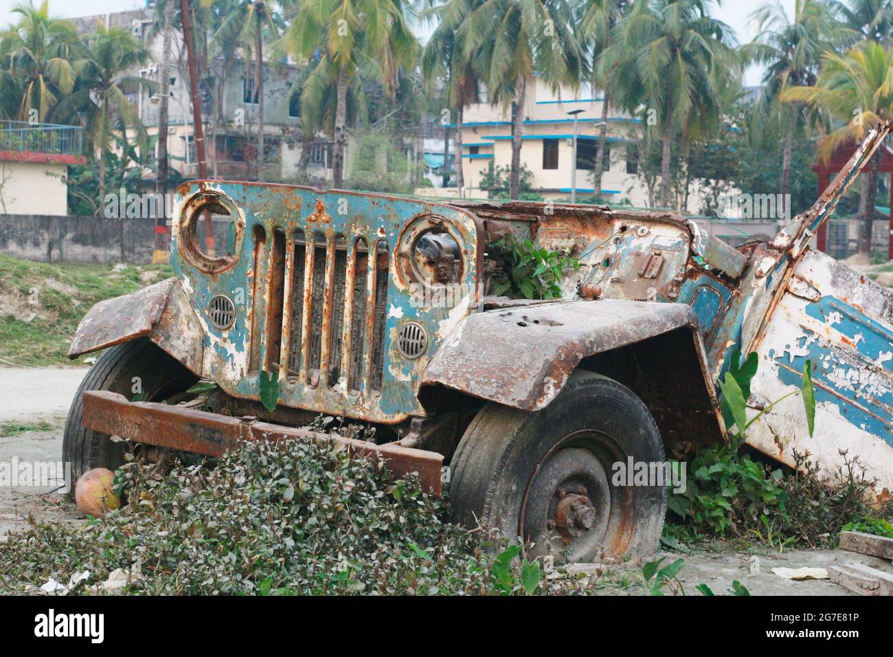 A very old broken car is lying on the side of the road Stock Photo - Alamy