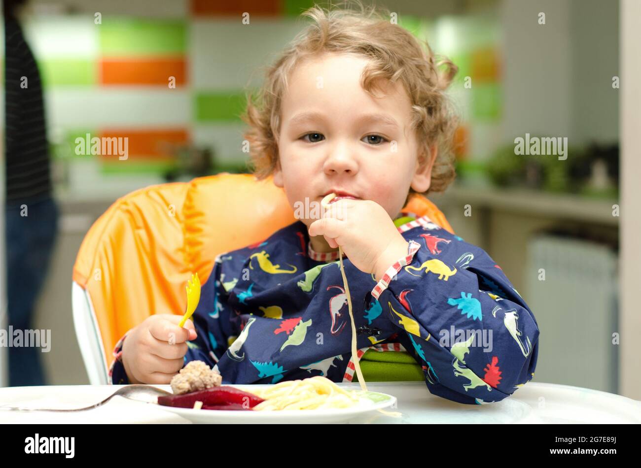 little child eating at home Stock Photo - Alamy