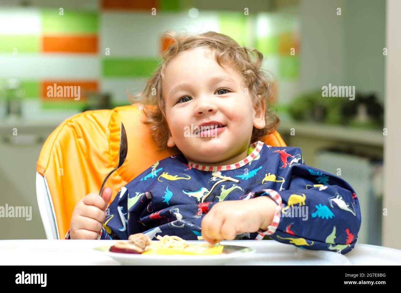 little child eating at home Stock Photo - Alamy