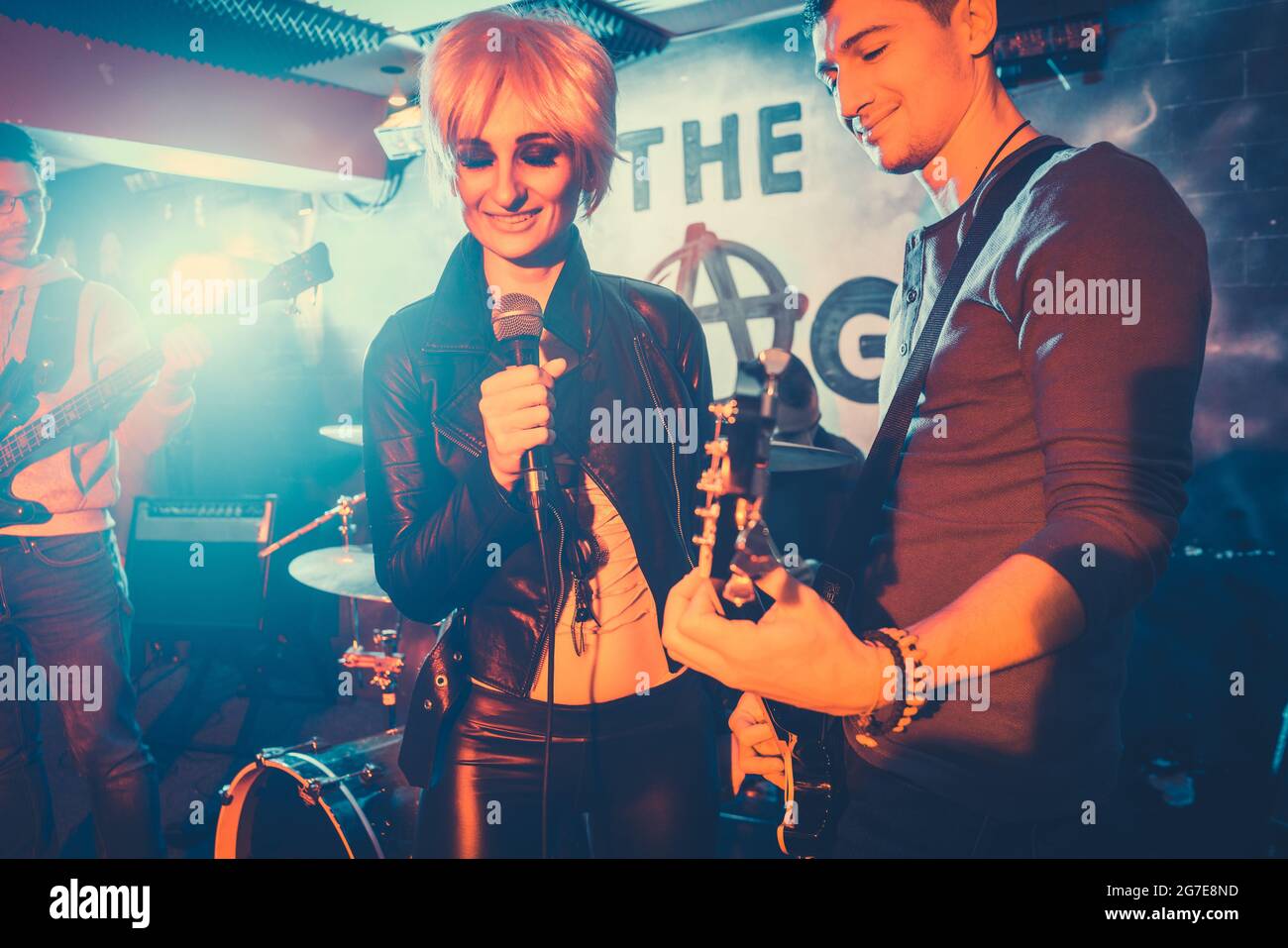 Singer and guitar player on stage during band gig or concert Stock ...