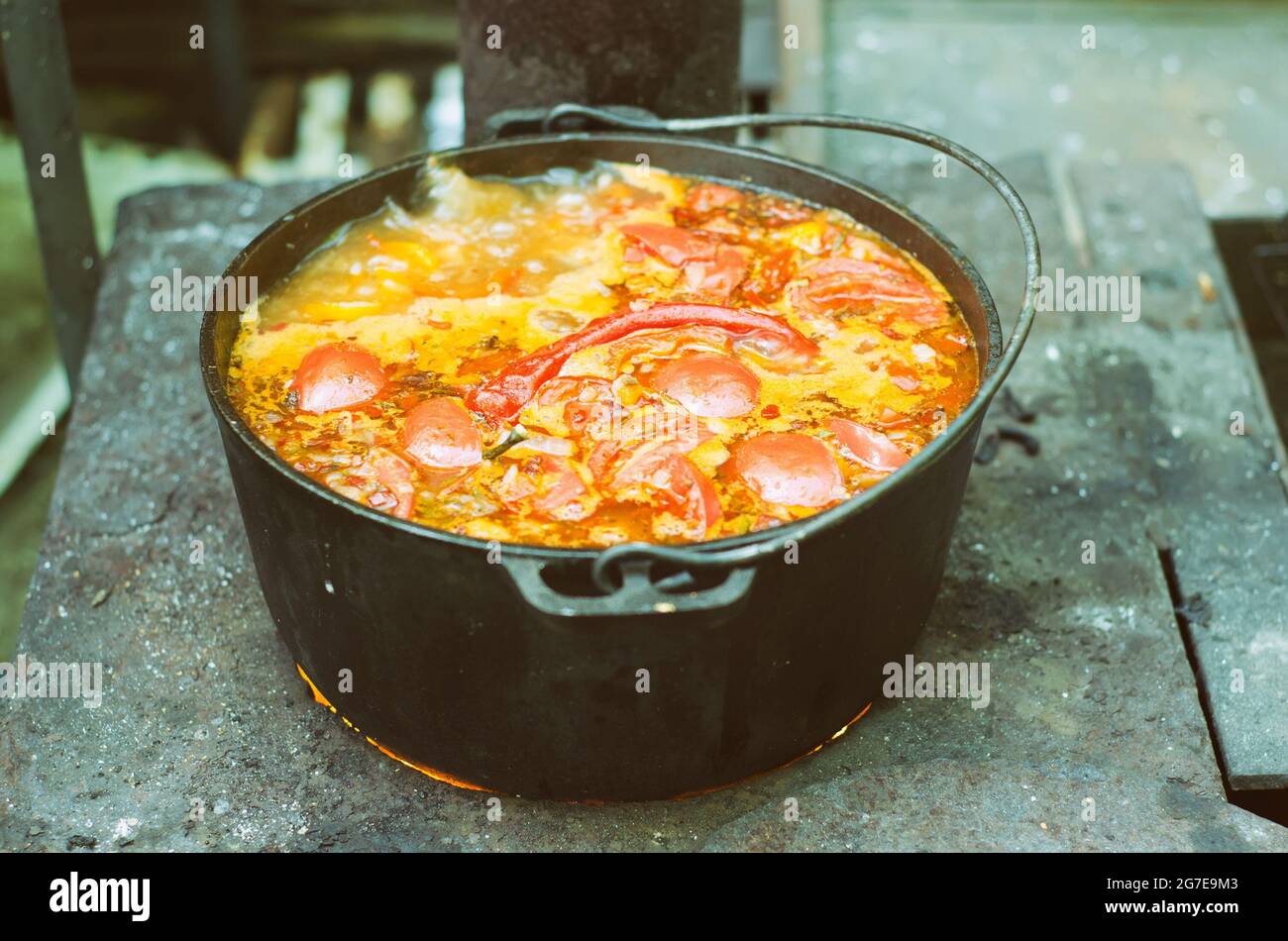 traditional soup cooking in cauldron Stock Photo - Alamy
