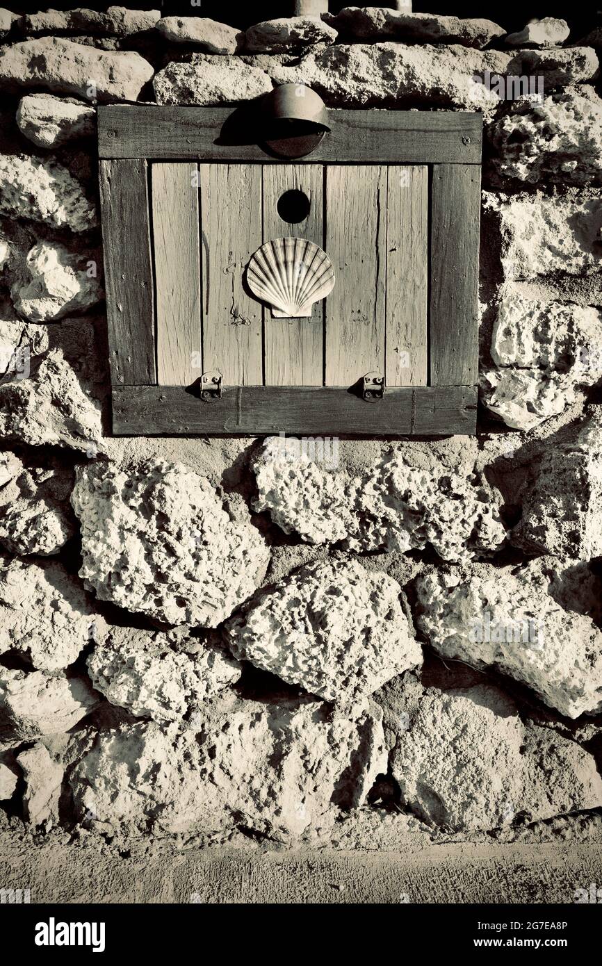 Shell on mail box set in wall of coral bricks in Key West, Florida, FL ...