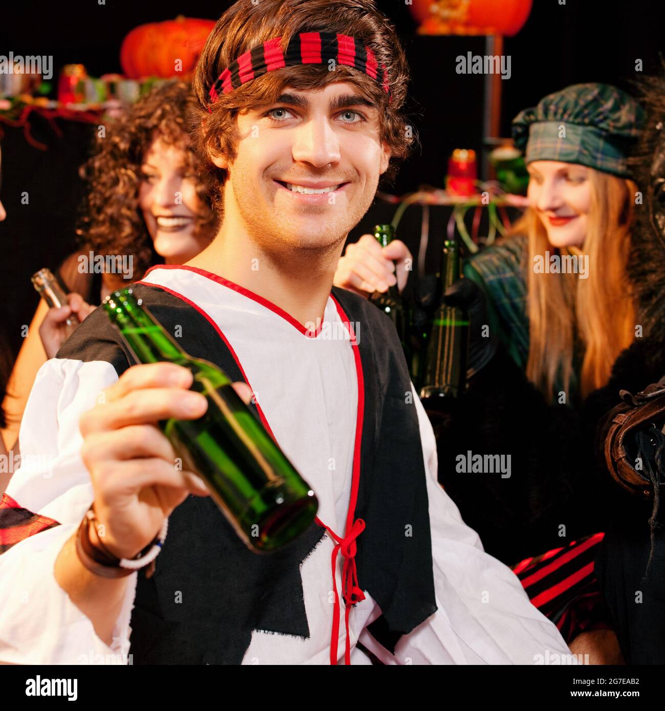 Group of young people celebrating a carnival or Halloween party in ...