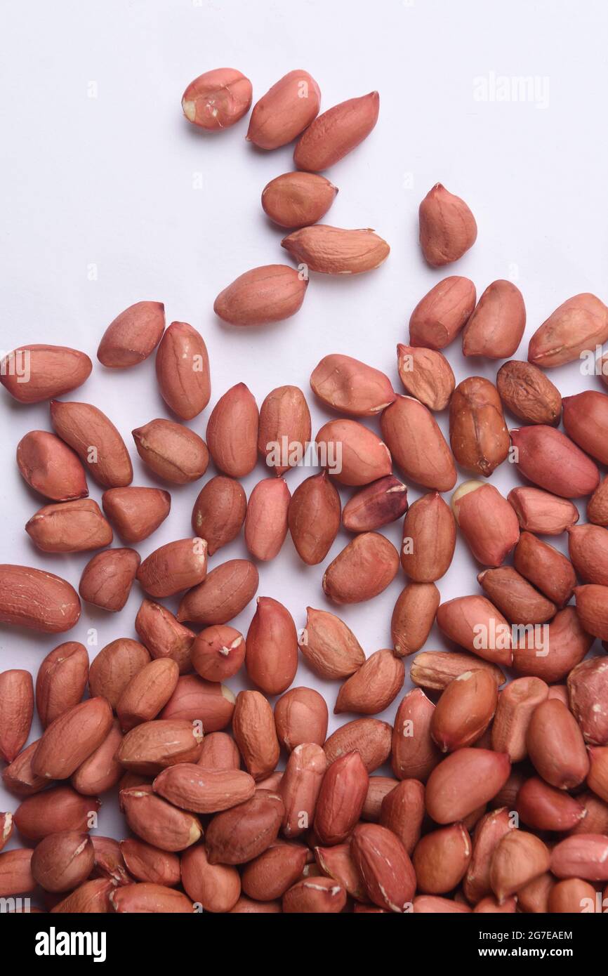 raw peanuts on white background Stock Photo - Alamy