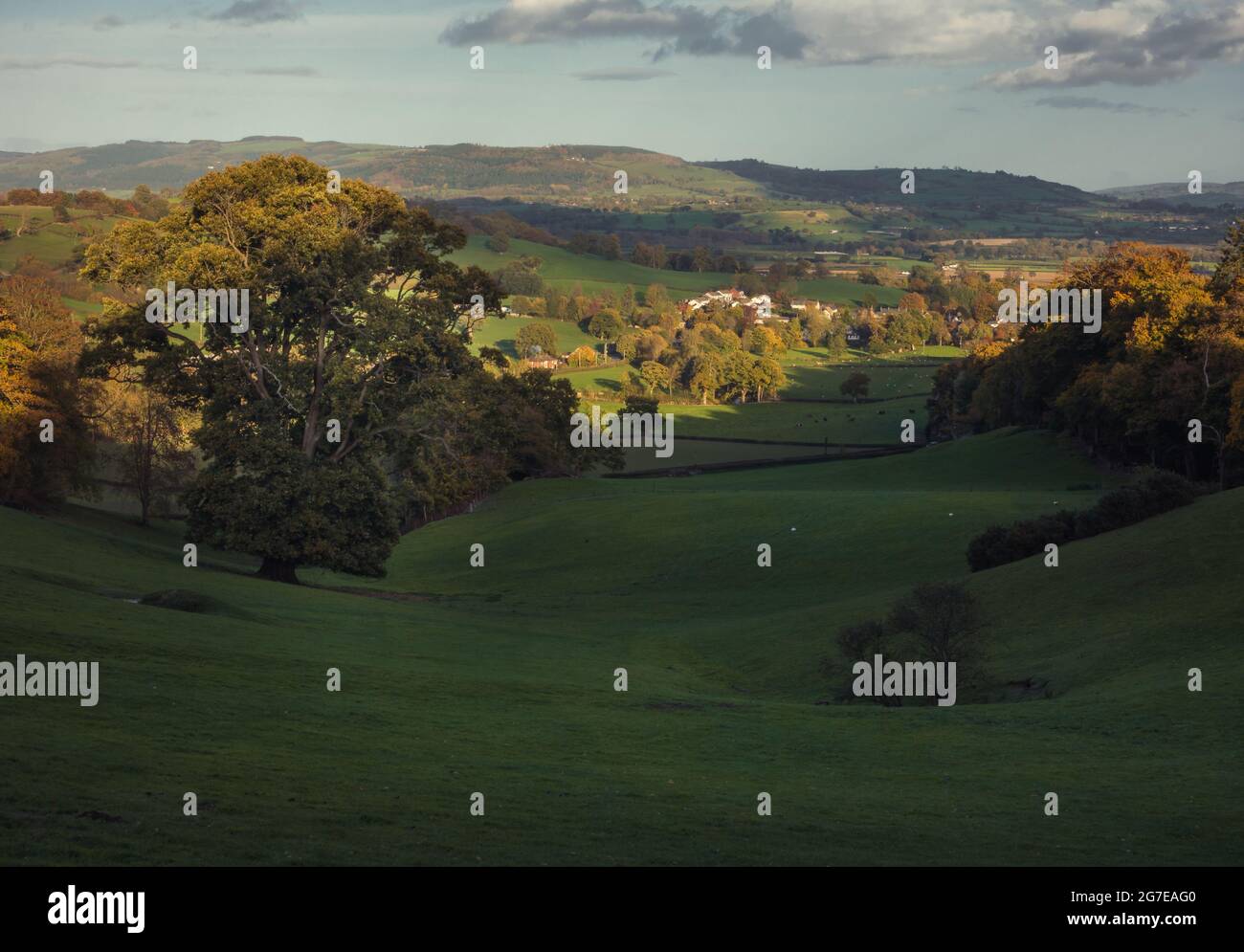 Dappled sunlight hitting the hills of a beautiful rural scene Stock ...