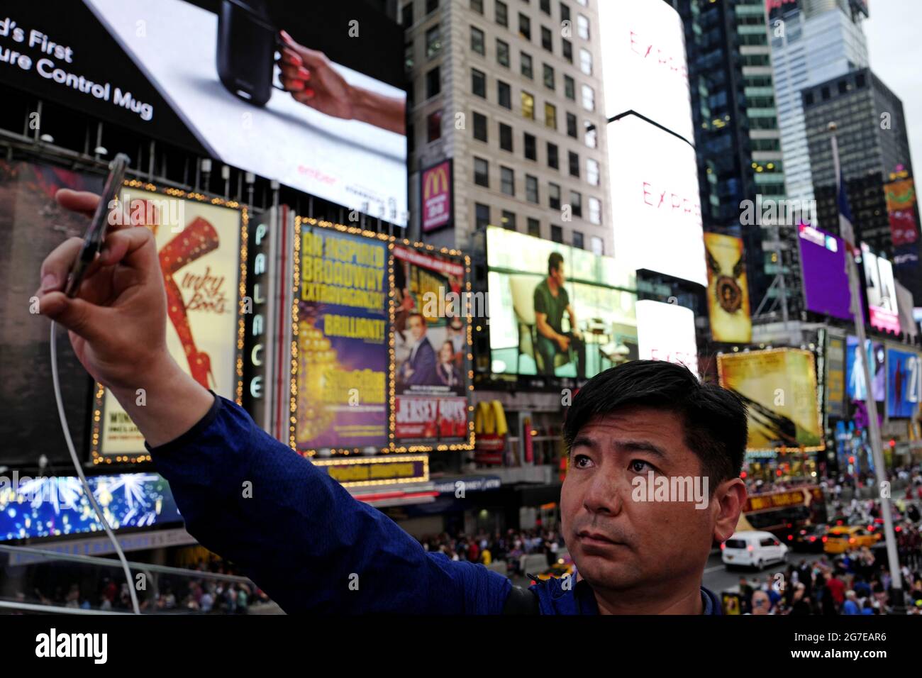 Tourists gathering at Times Square in Manhattan, in New York City Stock ...